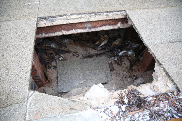 Sidewalk collapses into old steam tunnel | News, Sports, Jobs - Daily Press